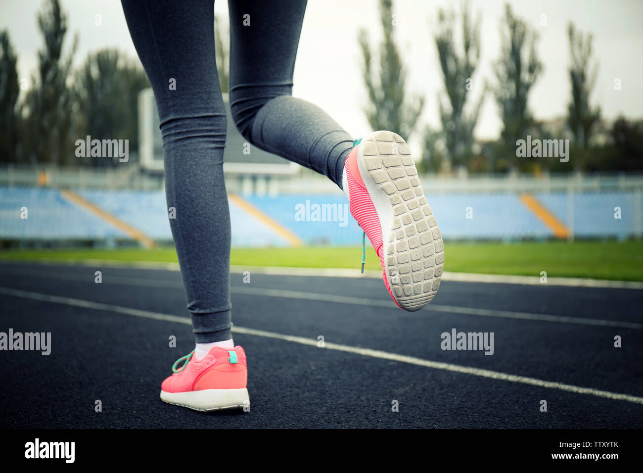 Runner legs at stadium Stock Photo - Alamy