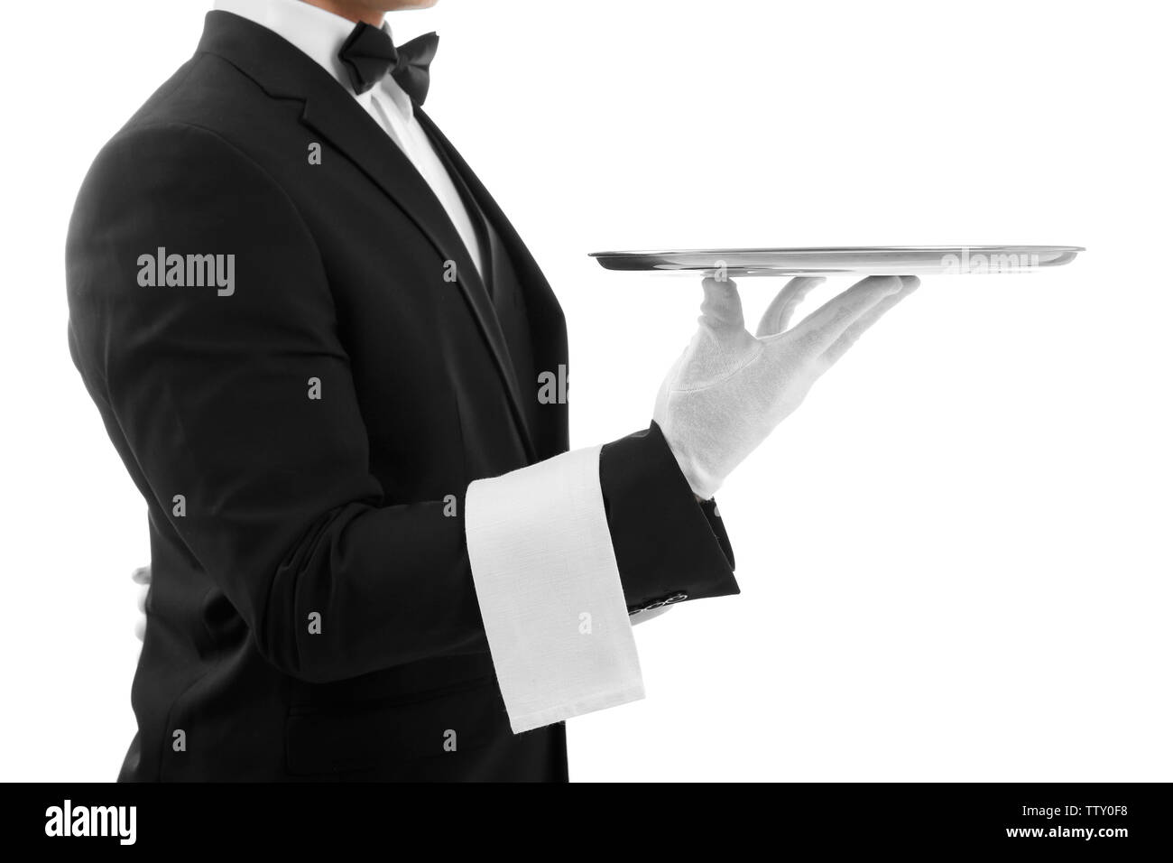 Male waiter holding tray on white background Stock Photo - Alamy