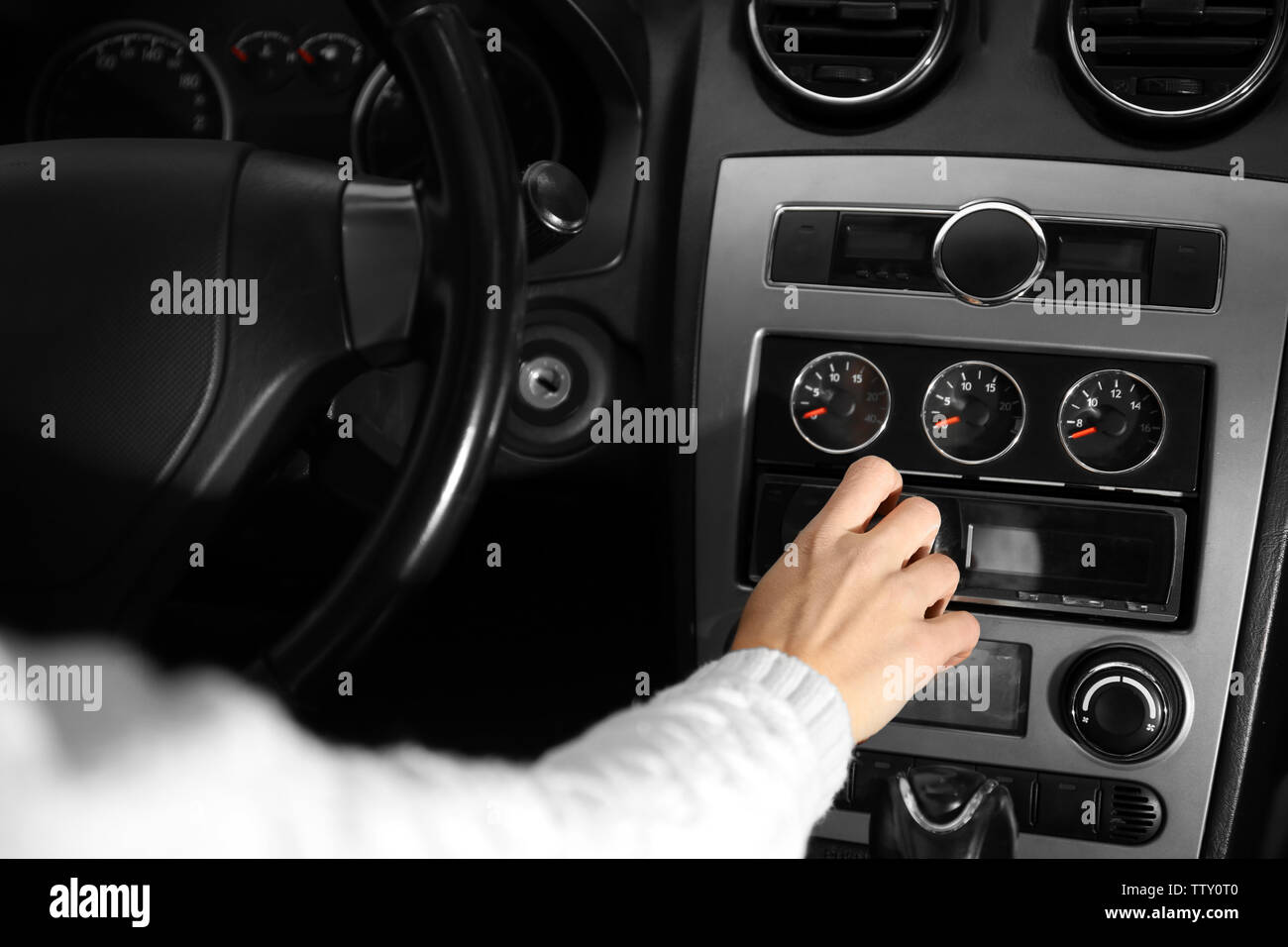 Car radio female hand hi-res stock photography and images - Alamy