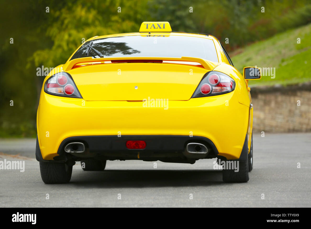 Rear view yellow taxi cab hi-res stock photography and images - Alamy