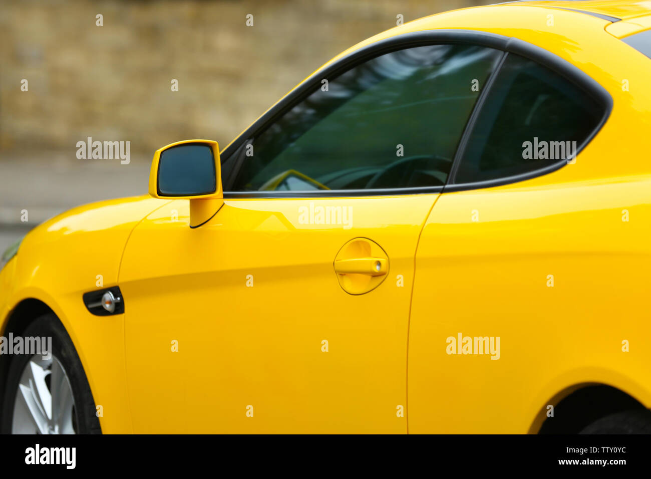 Modern yellow car, outdoor Stock Photo - Alamy
