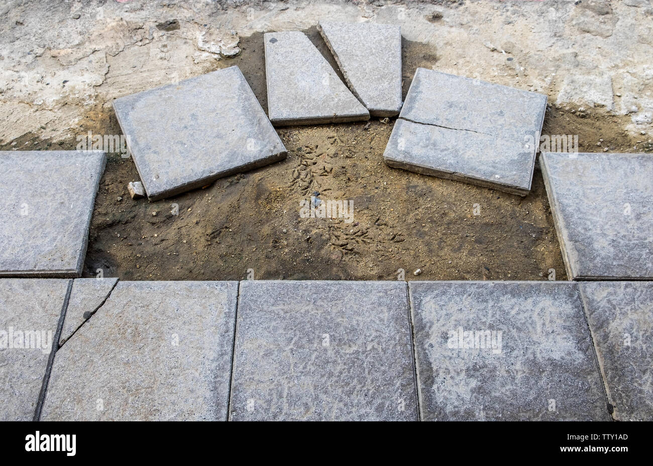 Floor tiles mortar blocks unfinished on pathway Stock Photo - Alamy
