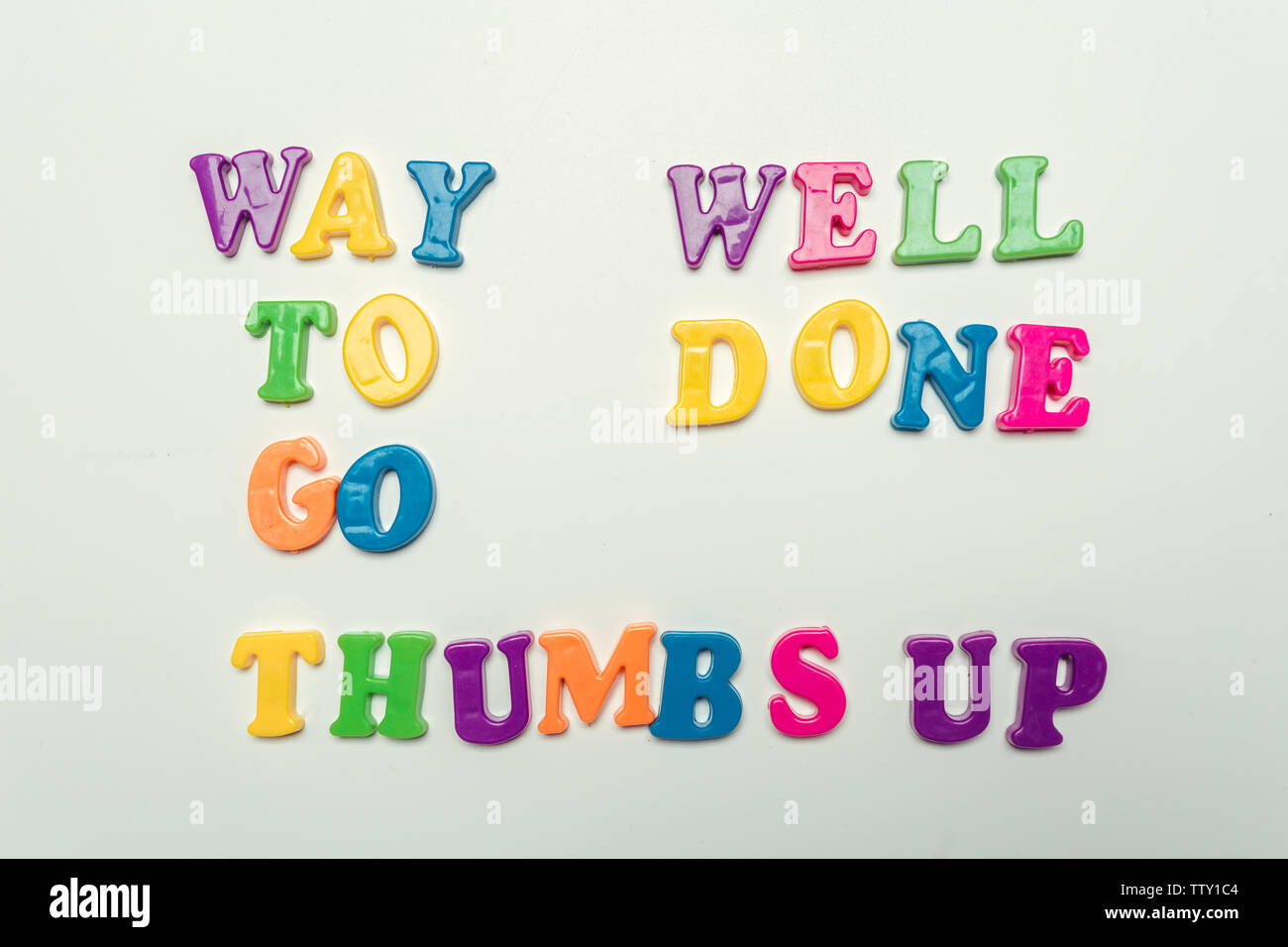 Way to go, Well done, thumbs up words in colorful letters on white ...