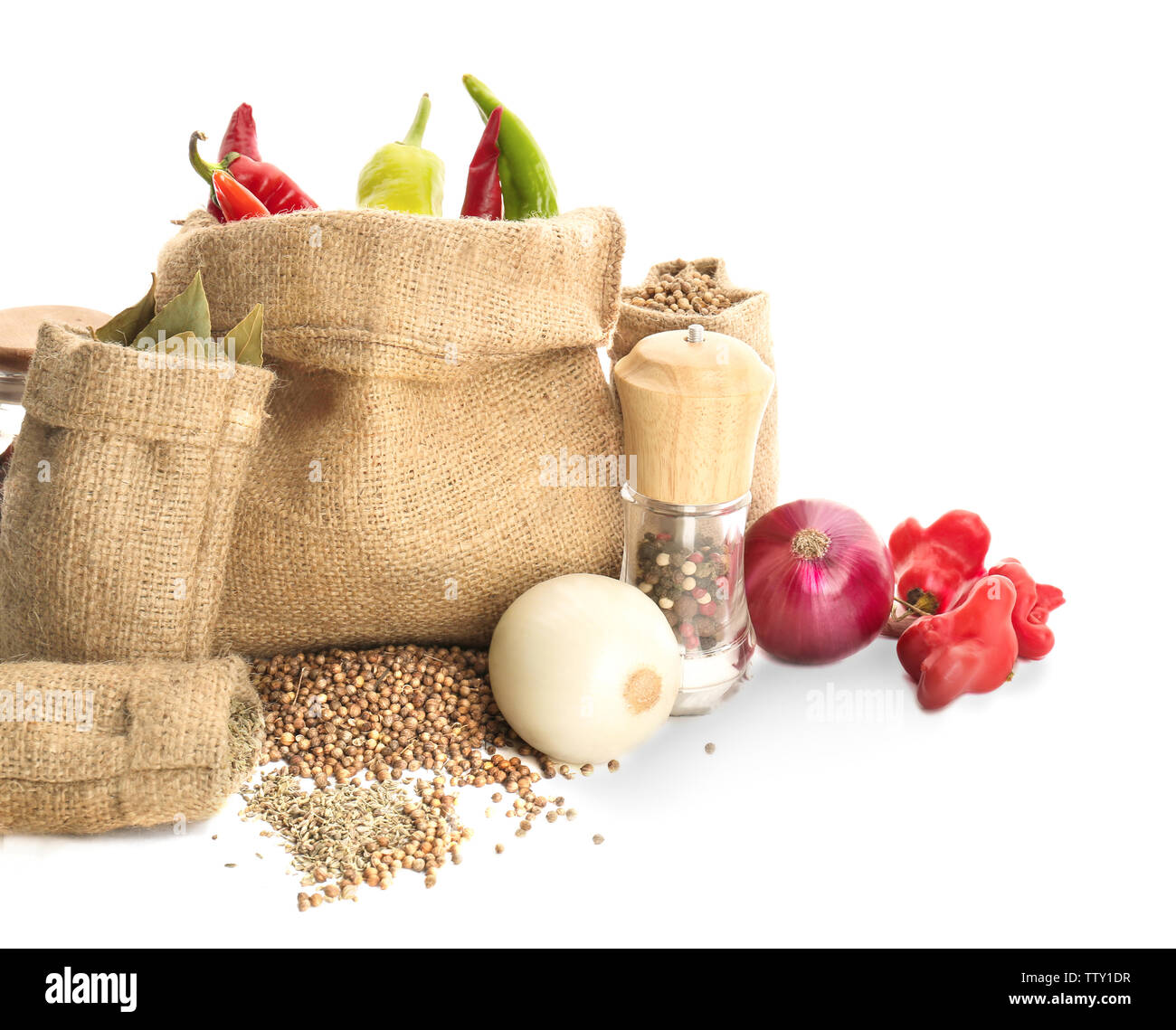 Spices in sacking bags on white background Stock Photo - Alamy