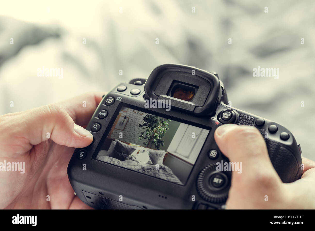photographer with camera in hand Stock Photo - Alamy