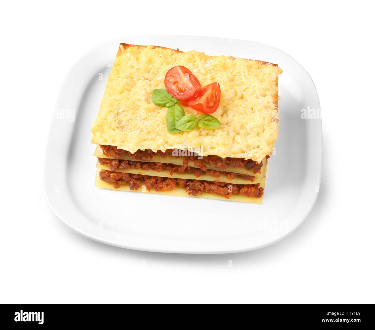 Italian lasagna on plate, white background Stock Photo - Alamy