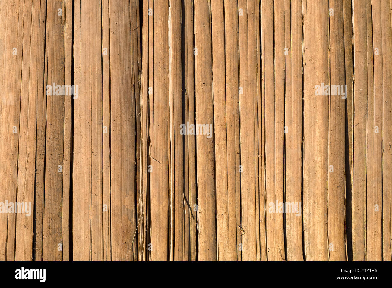 Brown bamboo strip fence closeup texture background Stock Photo - Alamy