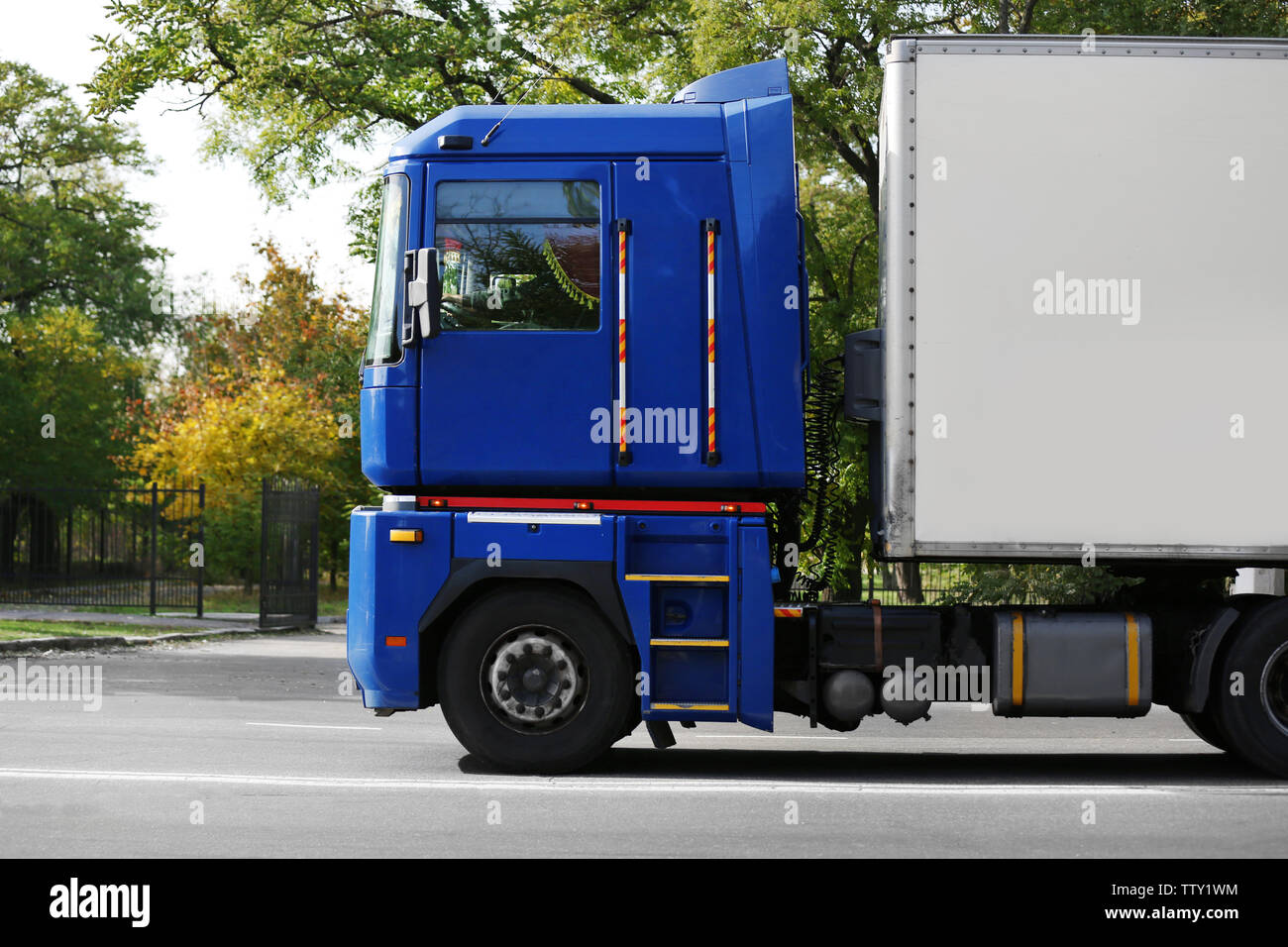 Side view of blue American cargo truck Stock Photo - Alamy