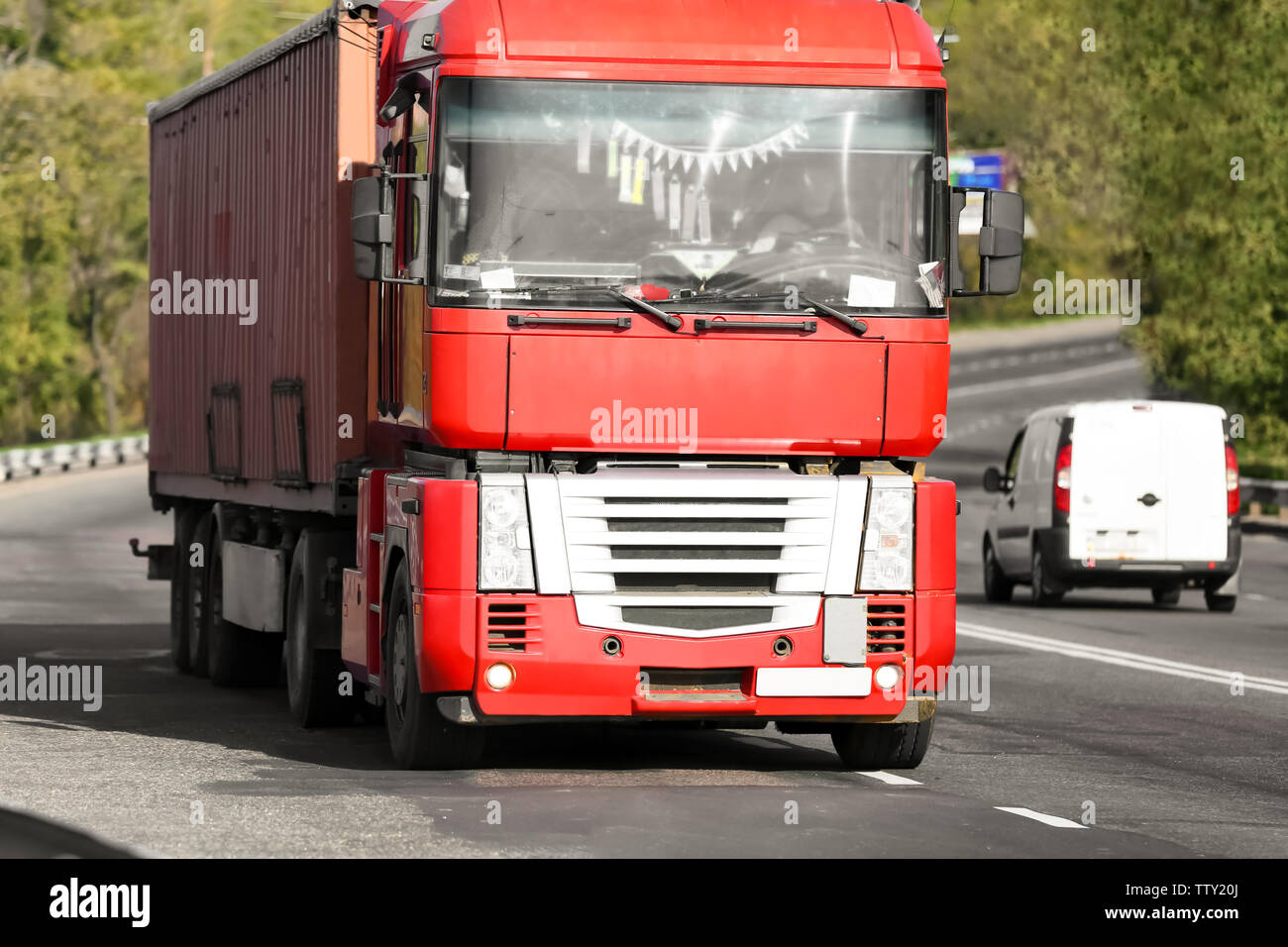 Front of red American cargo truck Stock Photo - Alamy