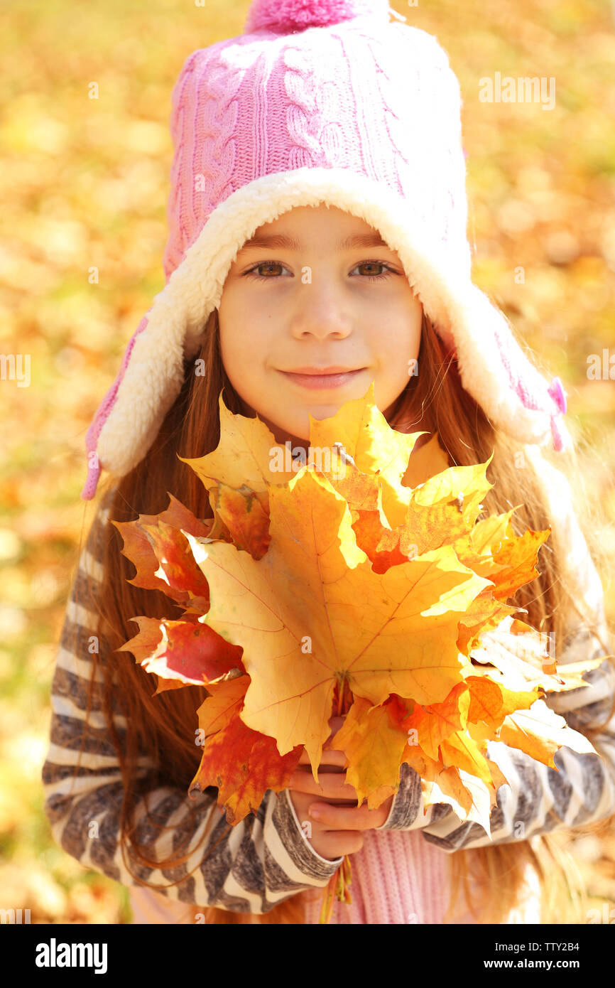 Portrait of cute little girl with leafs Stock Photo - Alamy