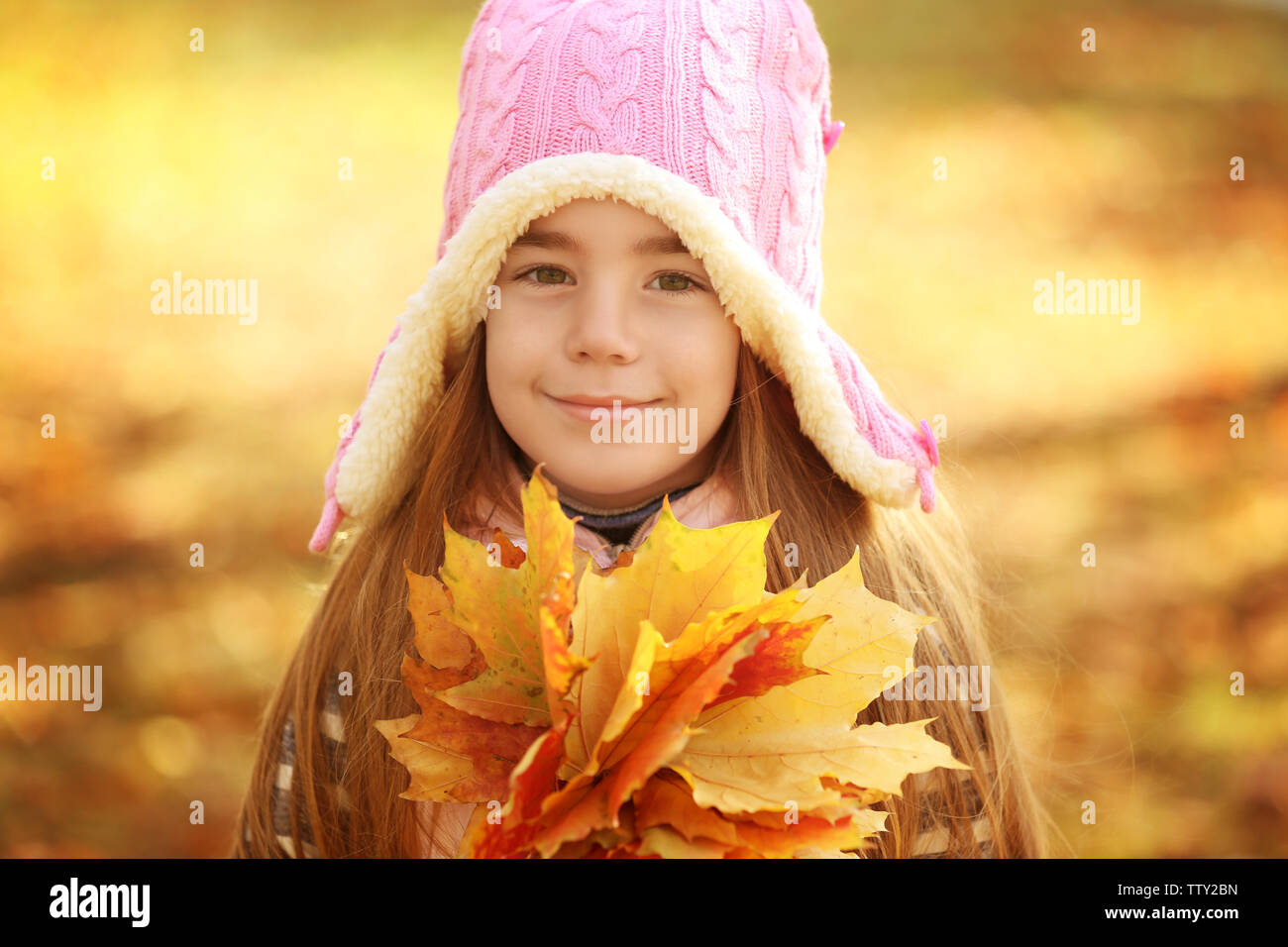 Portrait of cute little girl with leafs Stock Photo - Alamy