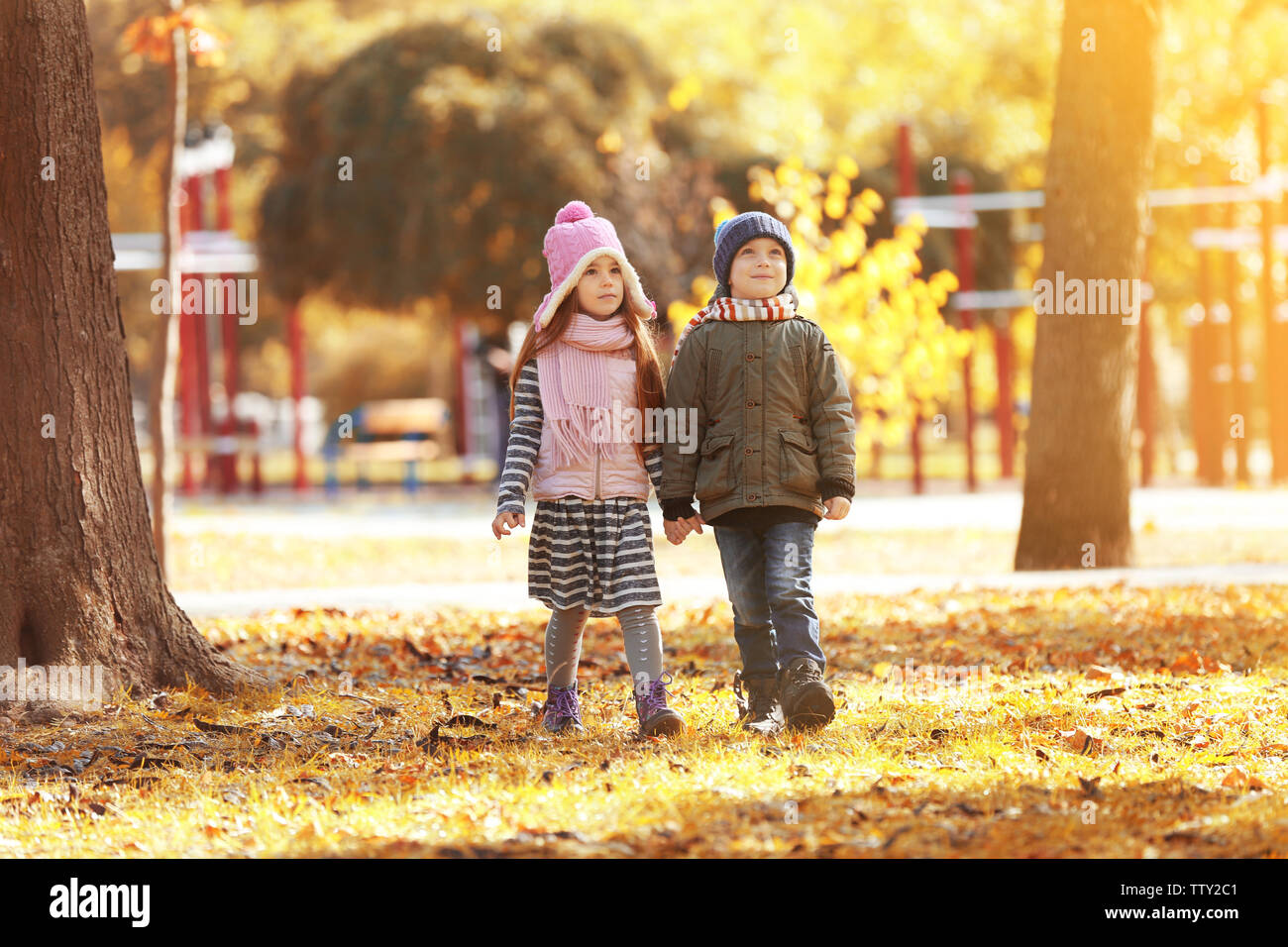 Children walking in park Stock Photo - Alamy