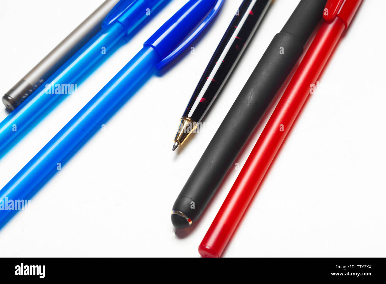 different colors pens isolated on the white background Stock Photo - Alamy