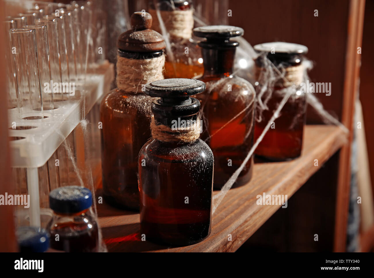 Vintage equipment of chemical laboratory on wooden shelf, closeup Stock ...