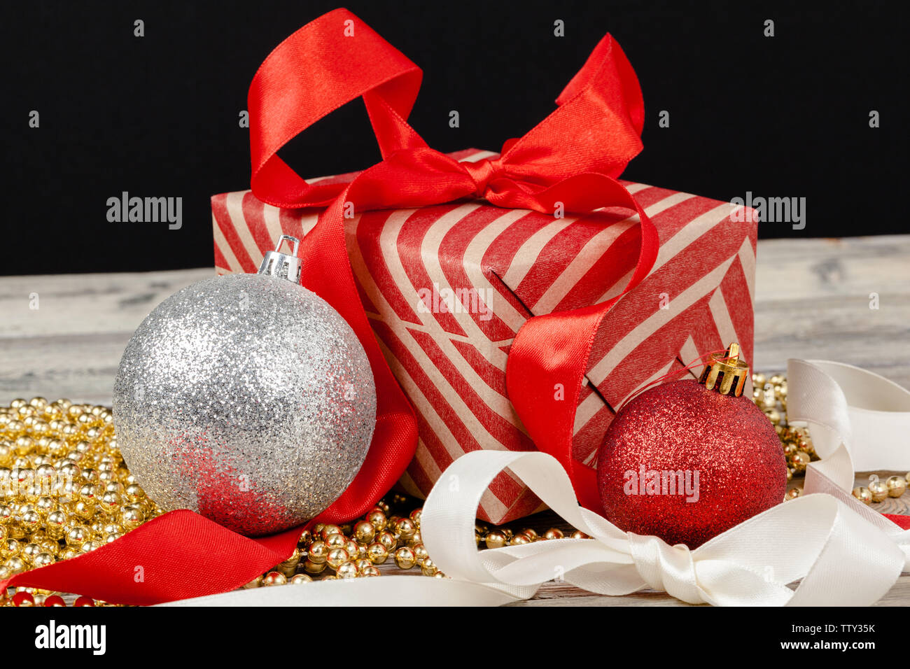 Christmas table decor with a gift box Stock Photo - Alamy