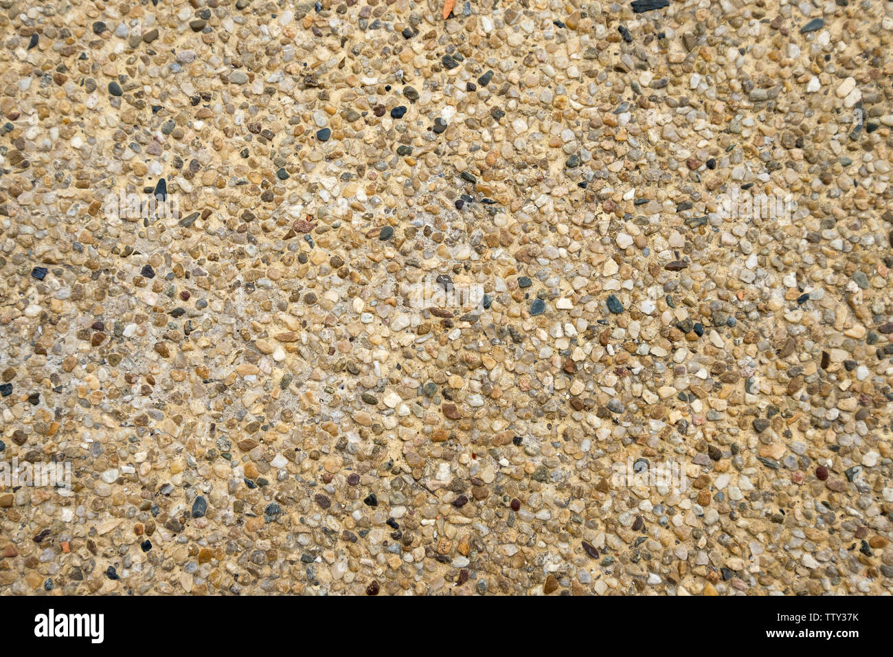Brown pebbles floor stone texture background Stock Photo - Alamy