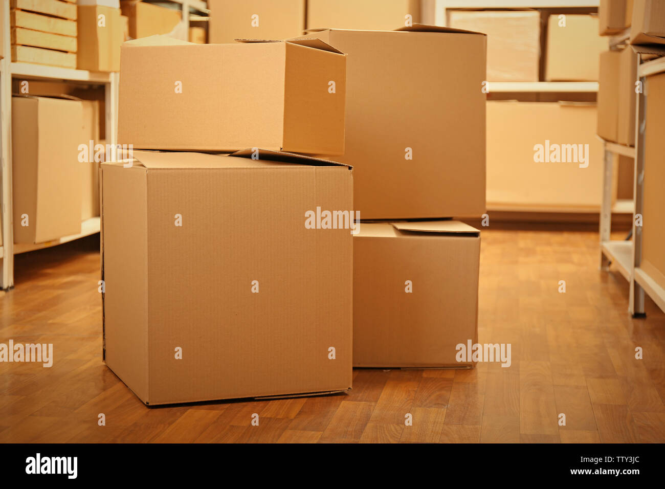 Modern warehouse full of cardboard boxes Stock Photo - Alamy