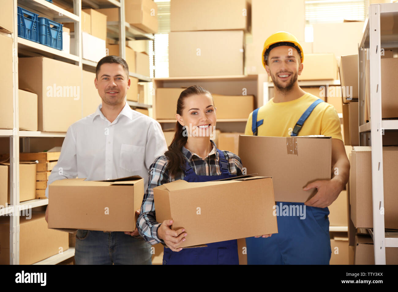 Business people working at warehouse Stock Photo - Alamy