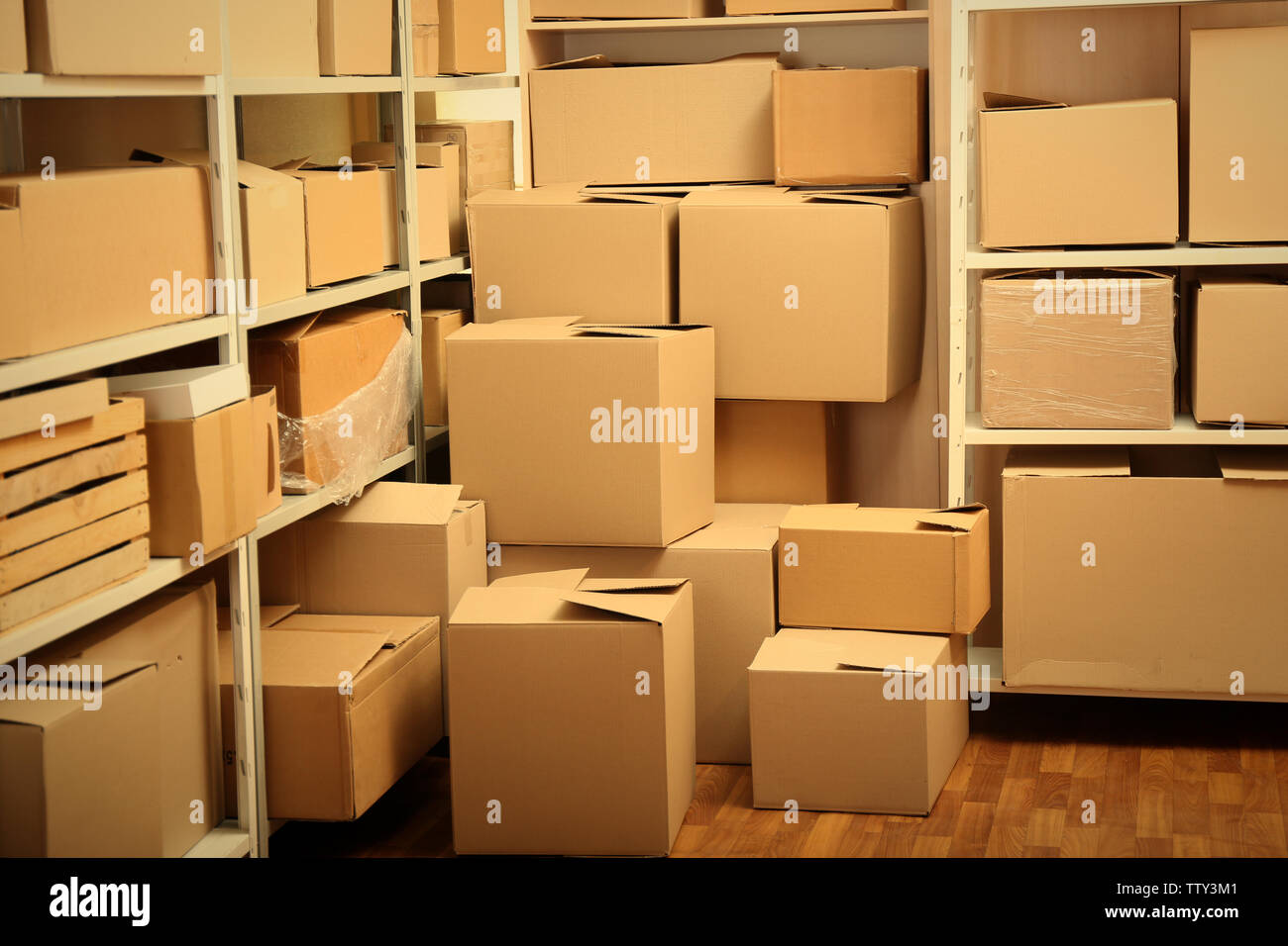 Modern warehouse full of cardboard boxes Stock Photo - Alamy