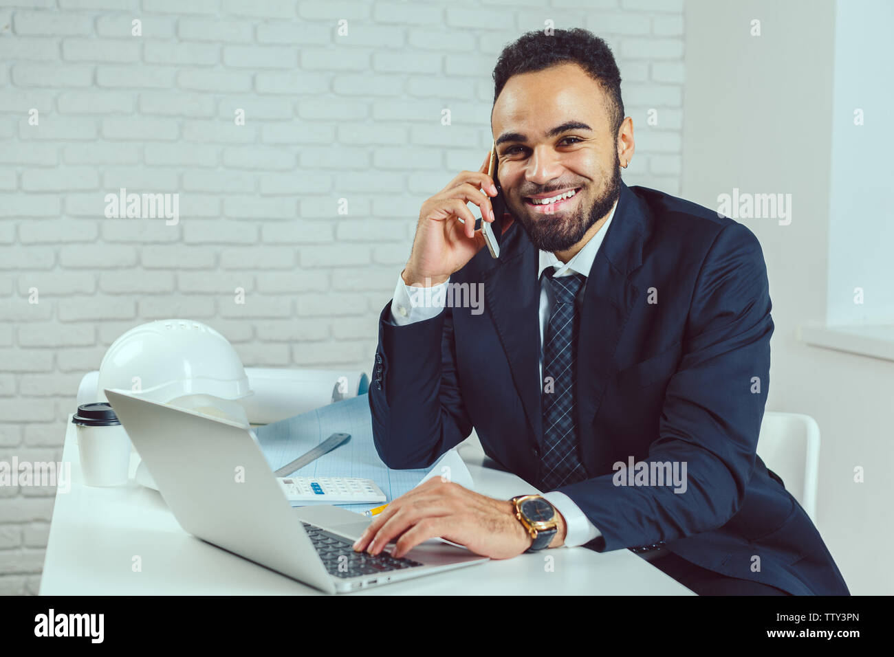 architect sitting at desk and working Stock Photo - Alamy