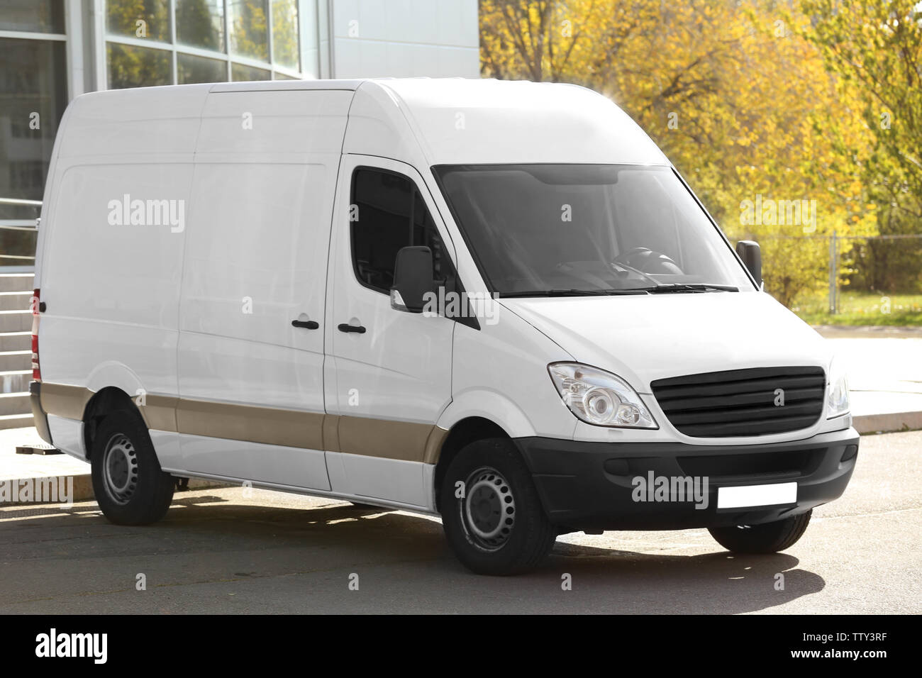 White van parked on street Stock Photo - Alamy