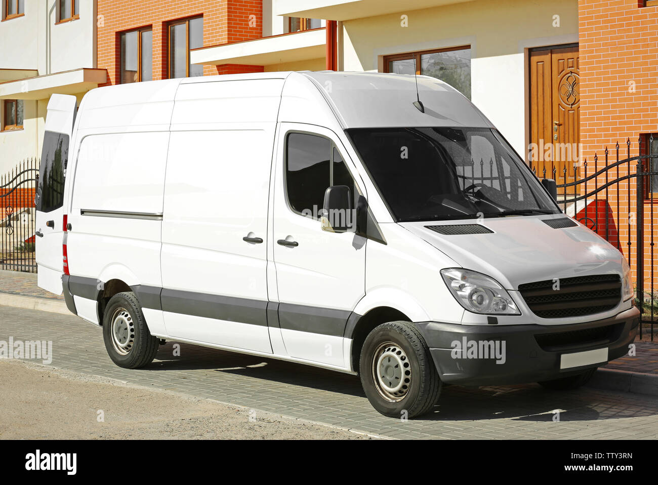 White van parked on street Stock Photo - Alamy
