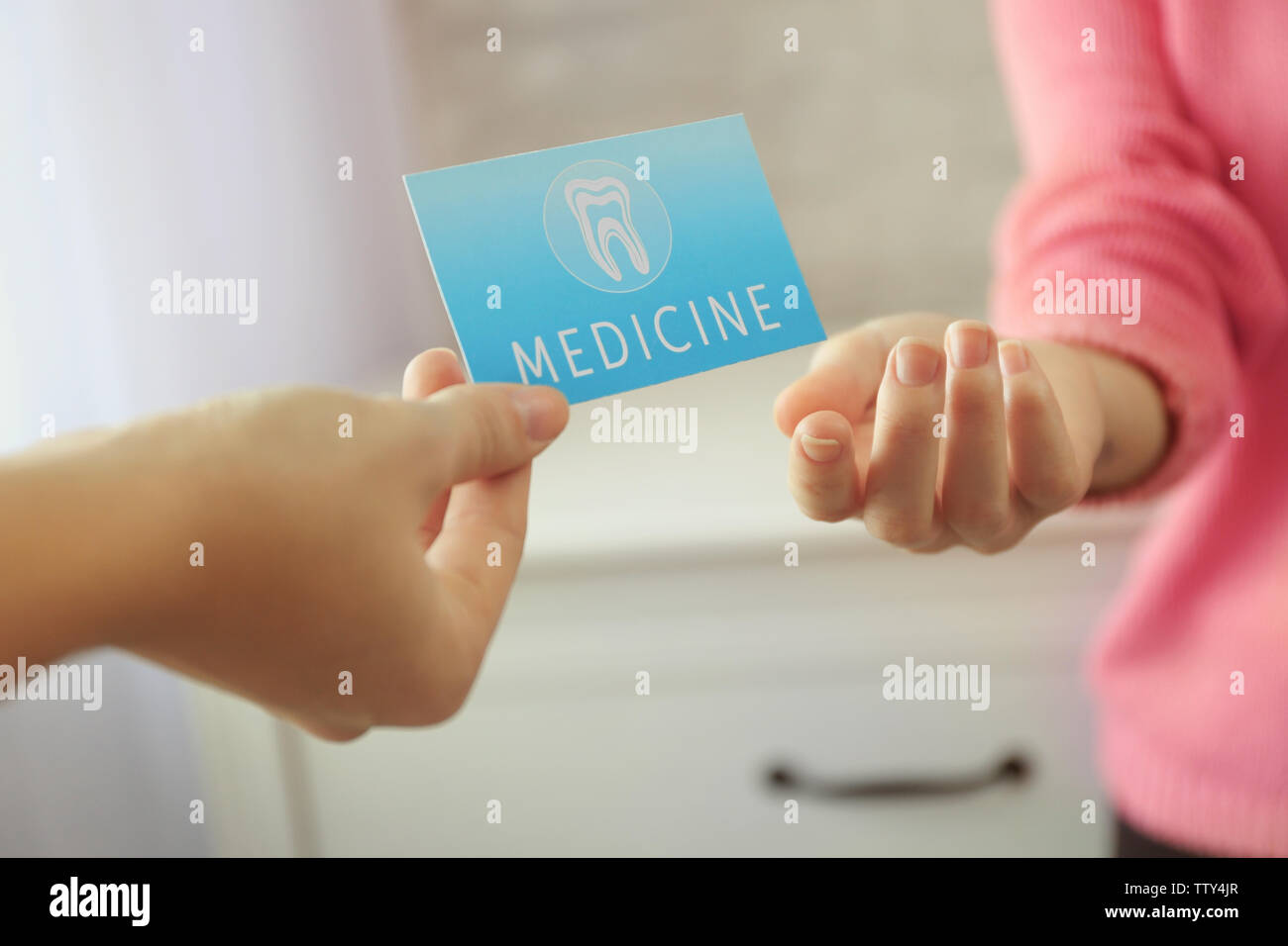 Doctor giving business card to patient, closeup Stock Photo - Alamy