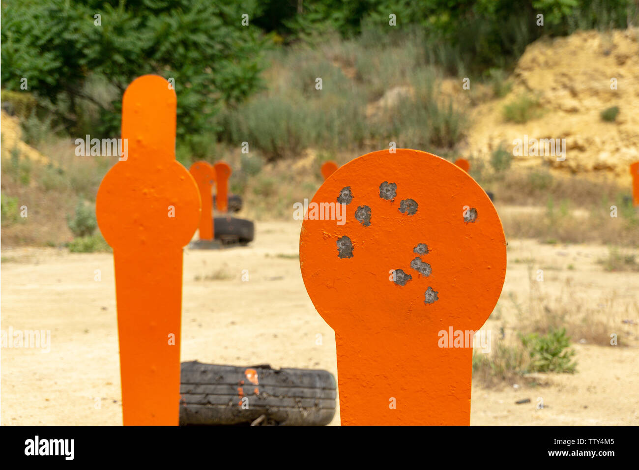 Metal orange popper targets on the range. Close-up Stock Photo - Alamy