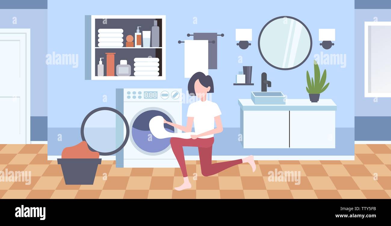 woman putting dirty clothes into washing machine housewife doing ...