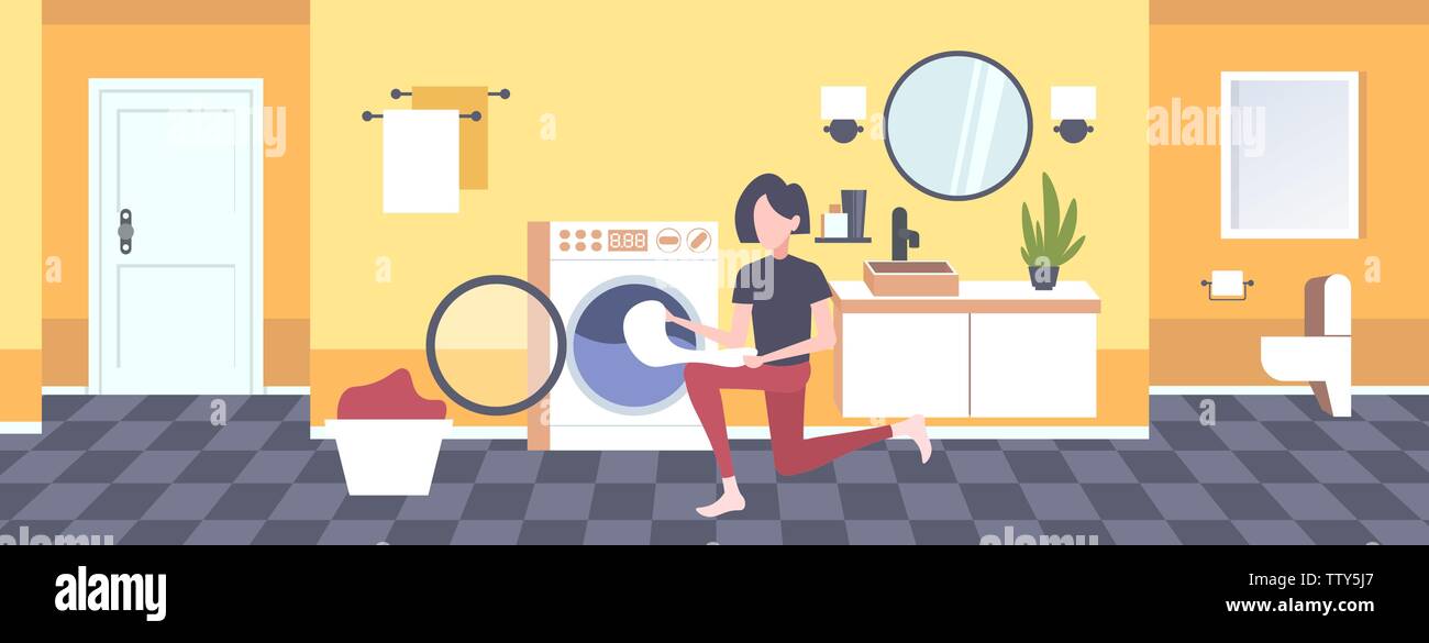 woman putting dirty clothes into washing machine housewife doing ...