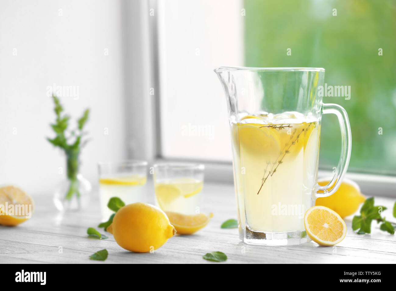 Cold fresh lemonade on windowsill Stock Photo - Alamy
