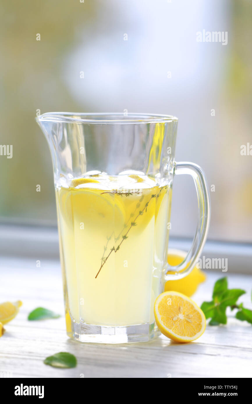 Cold fresh lemonade on windowsill Stock Photo - Alamy