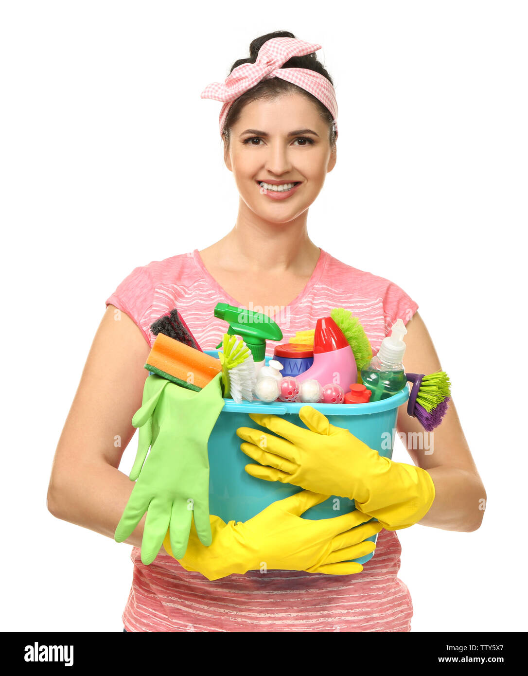 Young cleaner with cleaning tools on white background Stock Photo - Alamy