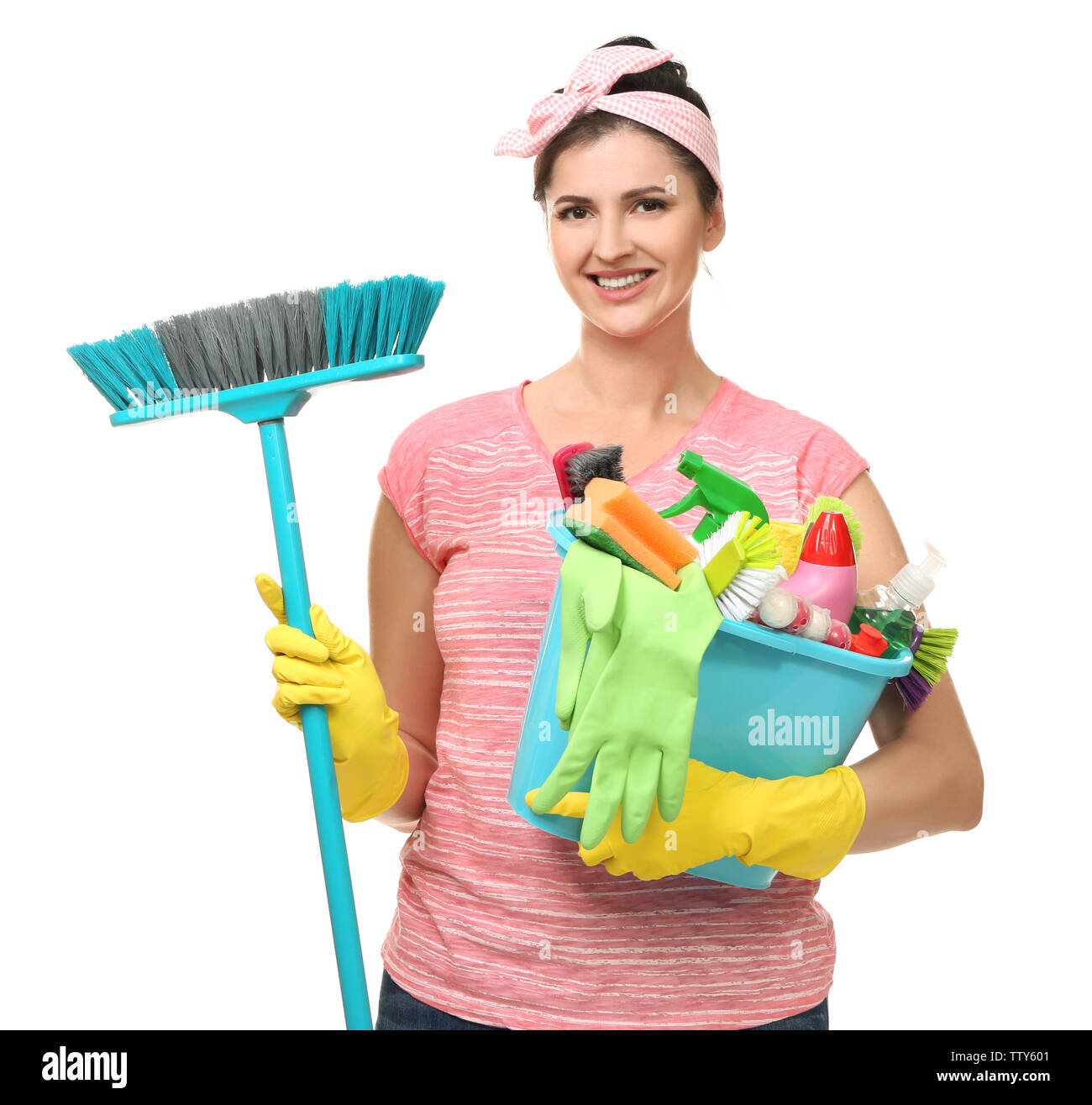 Young cleaner with cleaning tools on white background Stock Photo - Alamy
