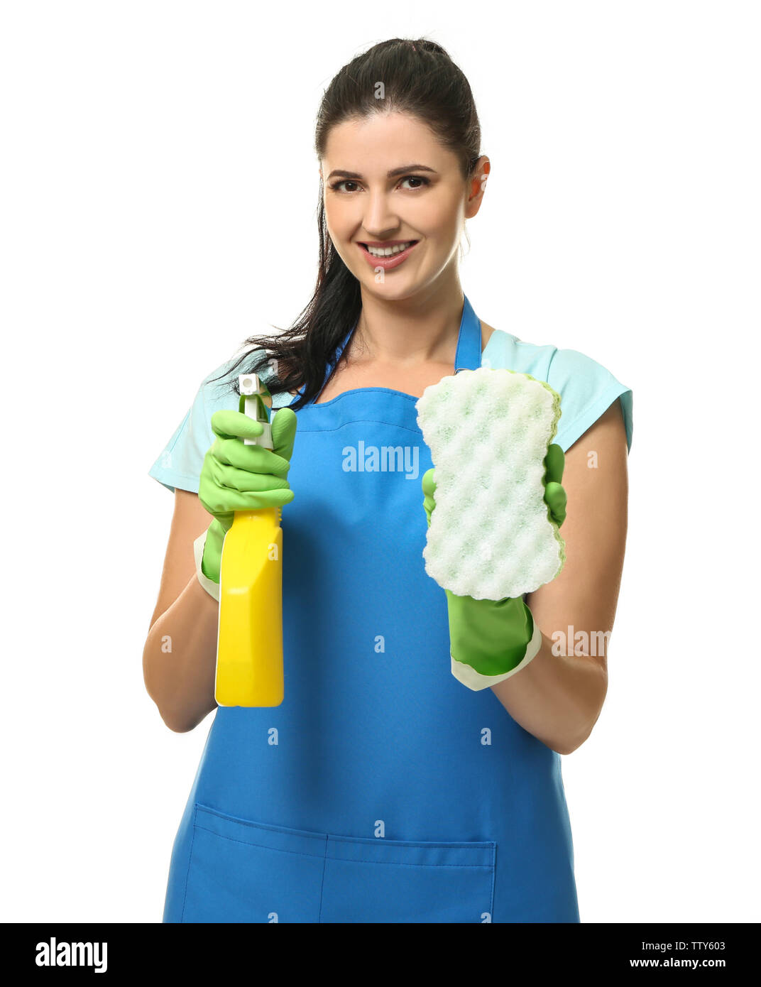 Young cleaner with sponge and spray on white background Stock Photo - Alamy