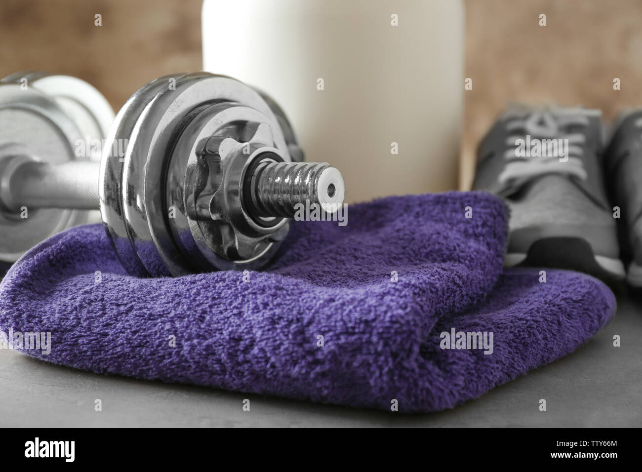 Sports concept. Workout objects on grey background Stock Photo - Alamy