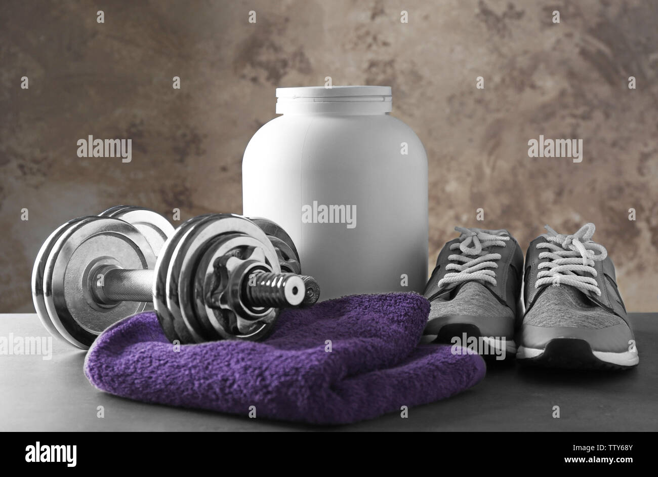Sports concept. Workout objects on grey background Stock Photo - Alamy