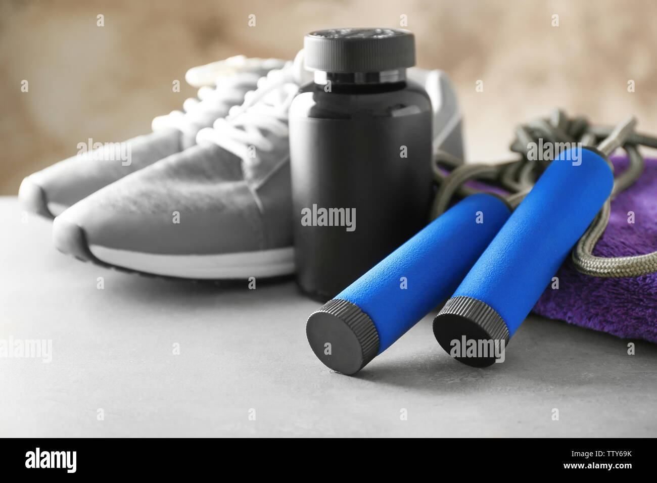 Sports concept. Workout objects on grey background Stock Photo - Alamy