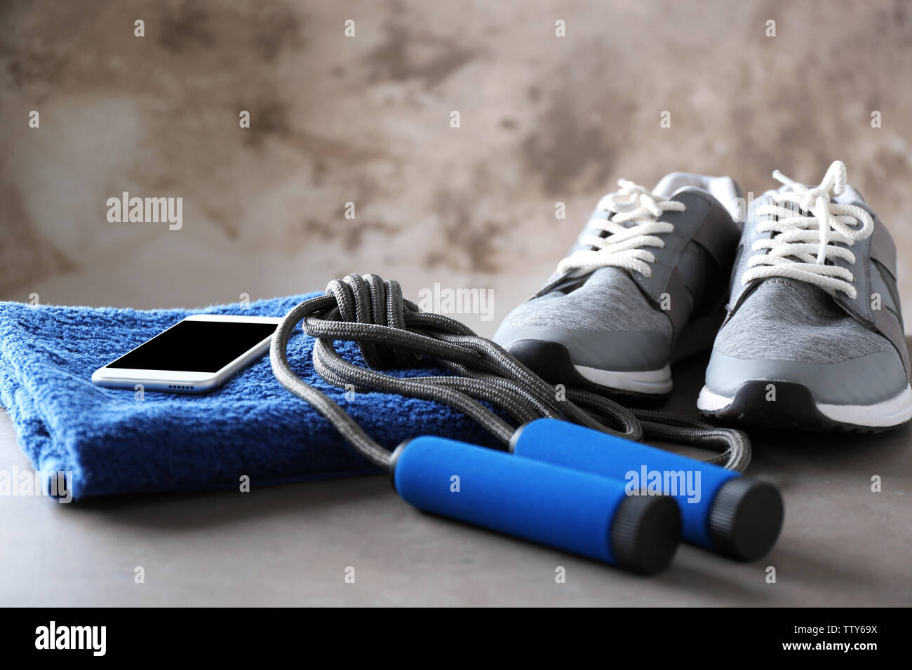 Sports concept. Workout objects on grey background Stock Photo - Alamy