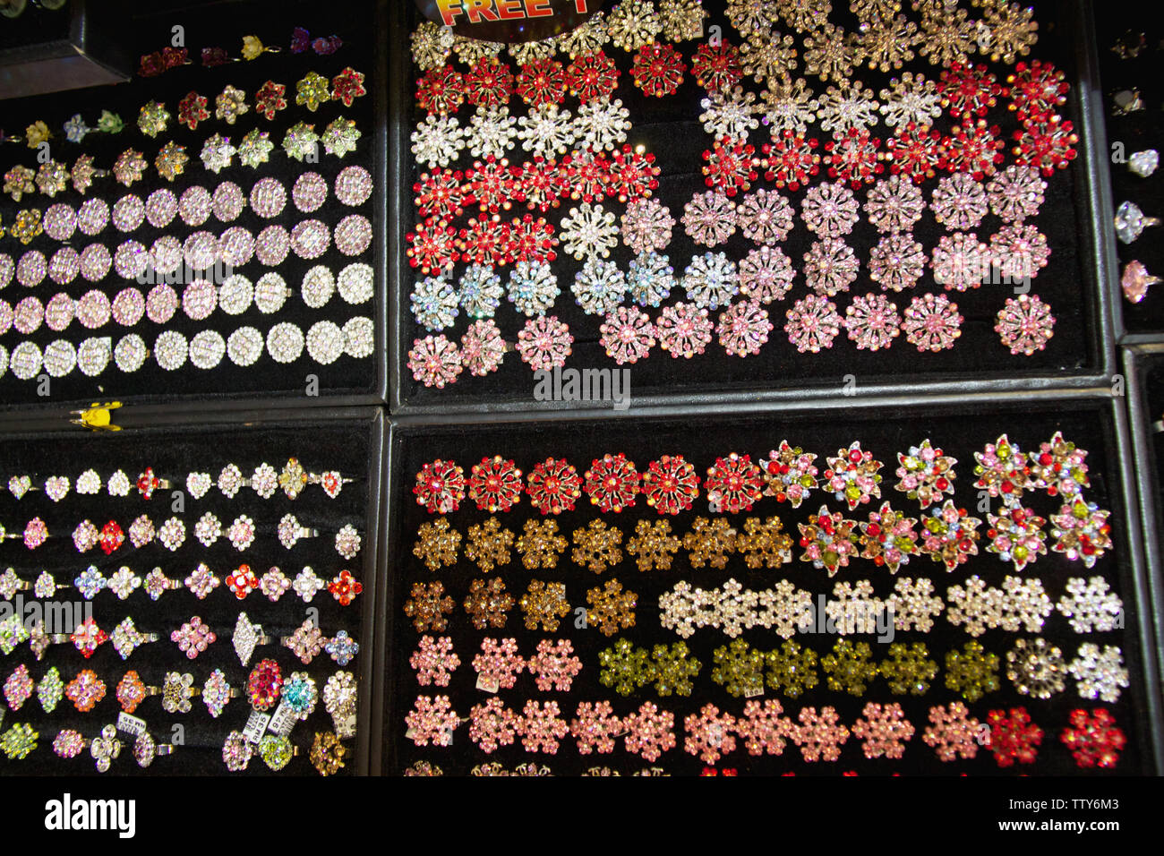 Assorted designed rings selling at a market stall, Malaysia Stock Photo ...