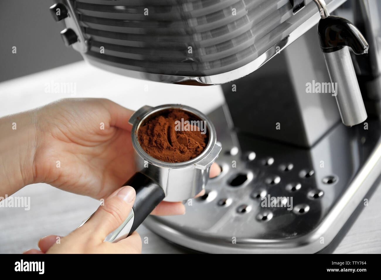 Woman making aromatic espresso in coffee machine, closeup Stock Photo ...