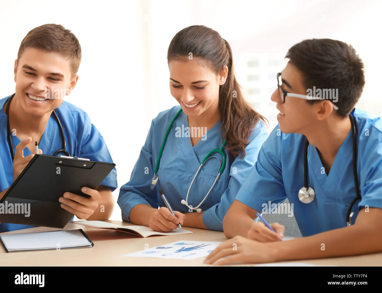 Group of medical students having lecture indoors Stock Photo - Alamy
