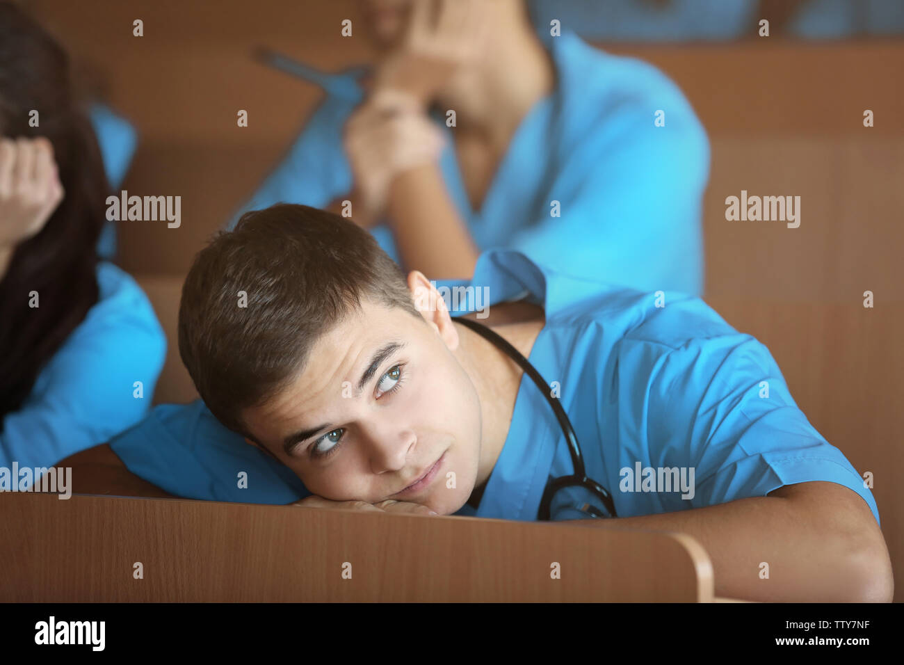 Smart male student at lecture indoors Stock Photo - Alamy