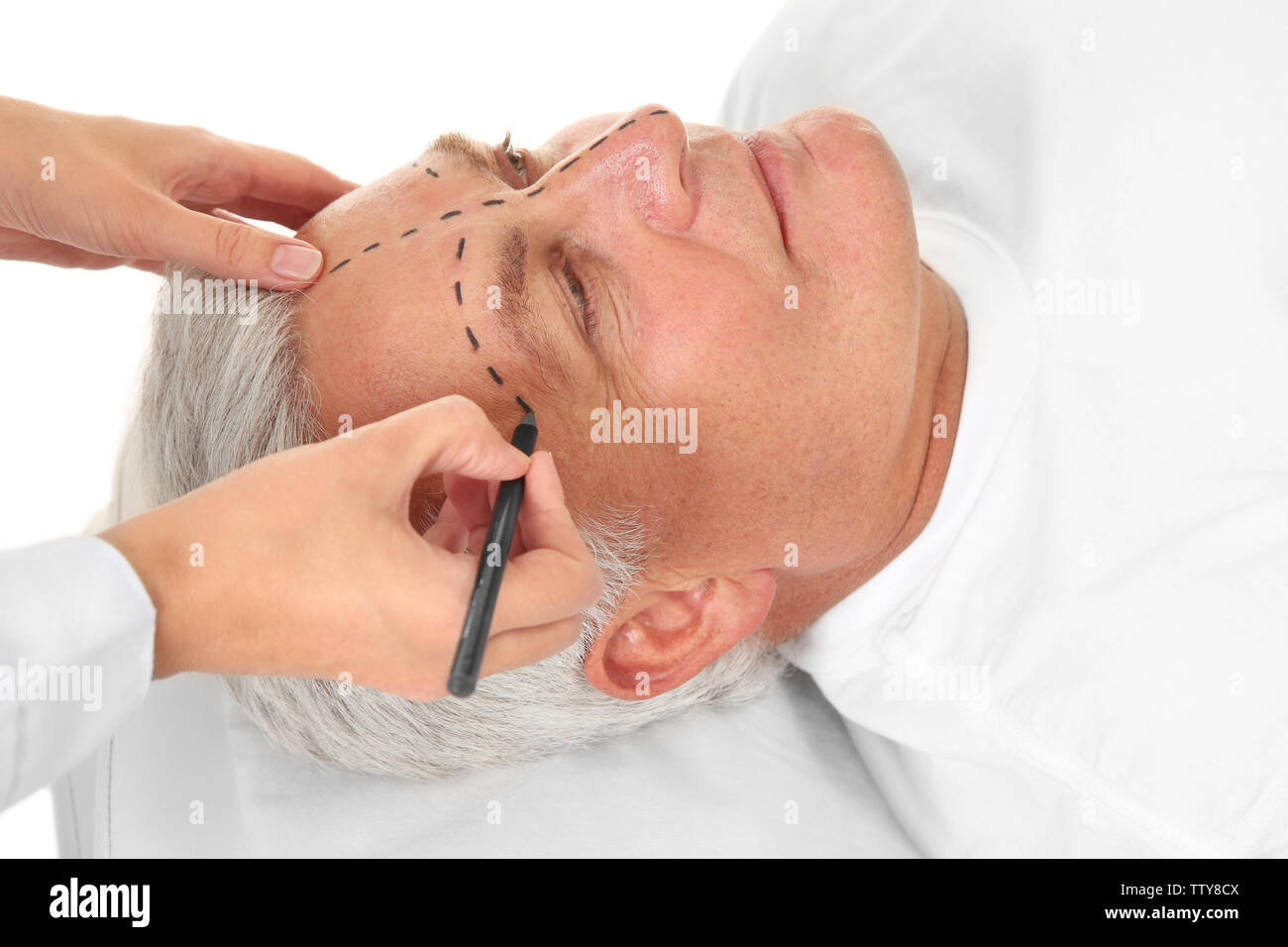 Female hand drawing correction line on man's face, close up Stock Photo ...