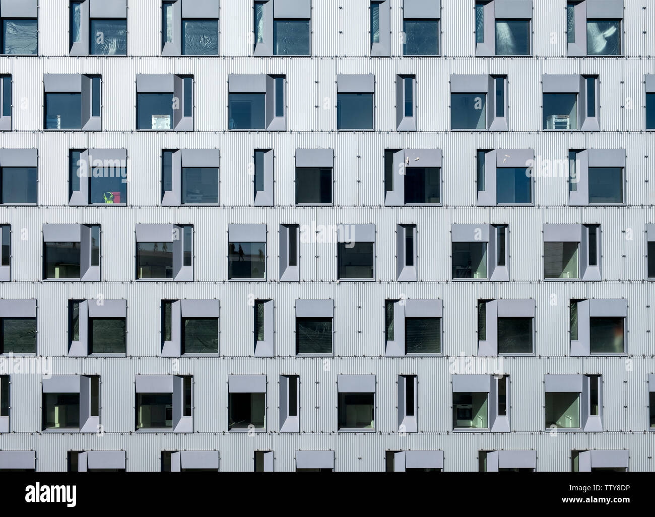 Pattern glass windows on residence building background Stock Photo - Alamy