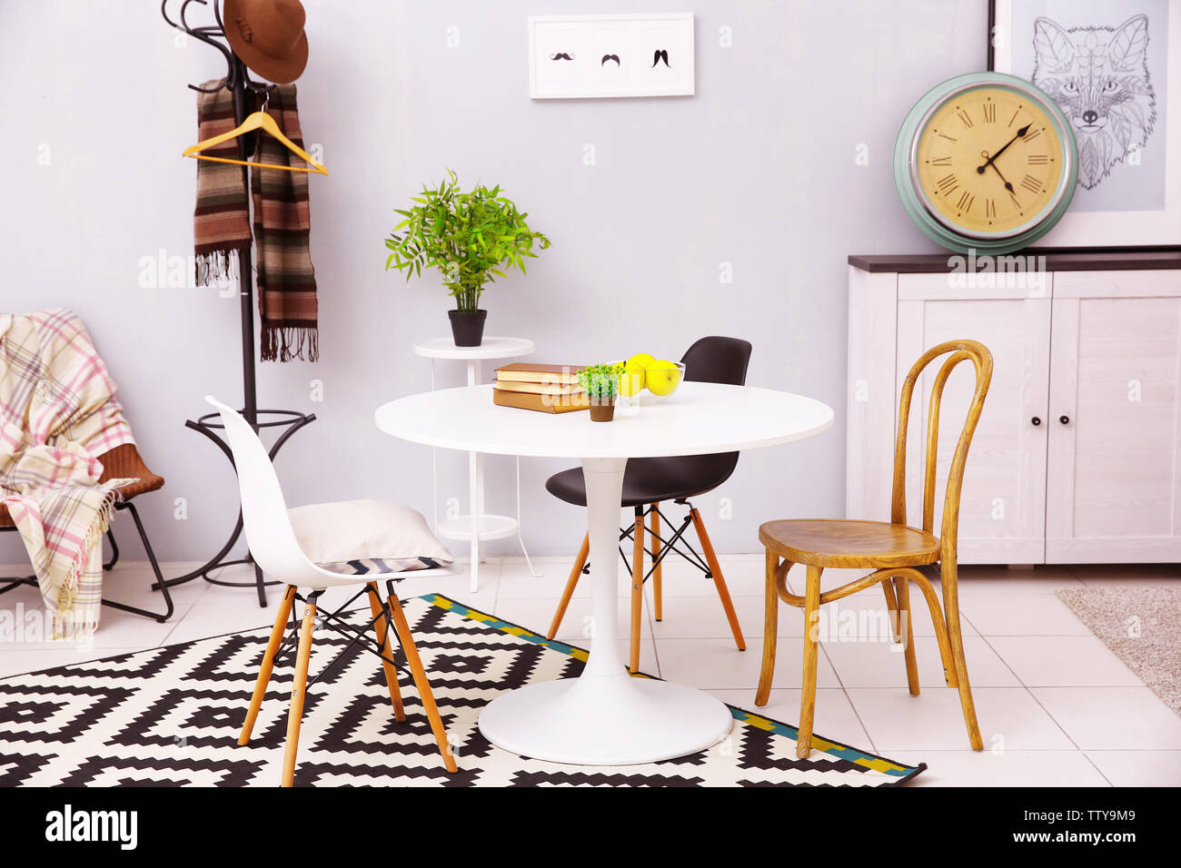 Neutral interior with table on gray wall background Stock Photo - Alamy