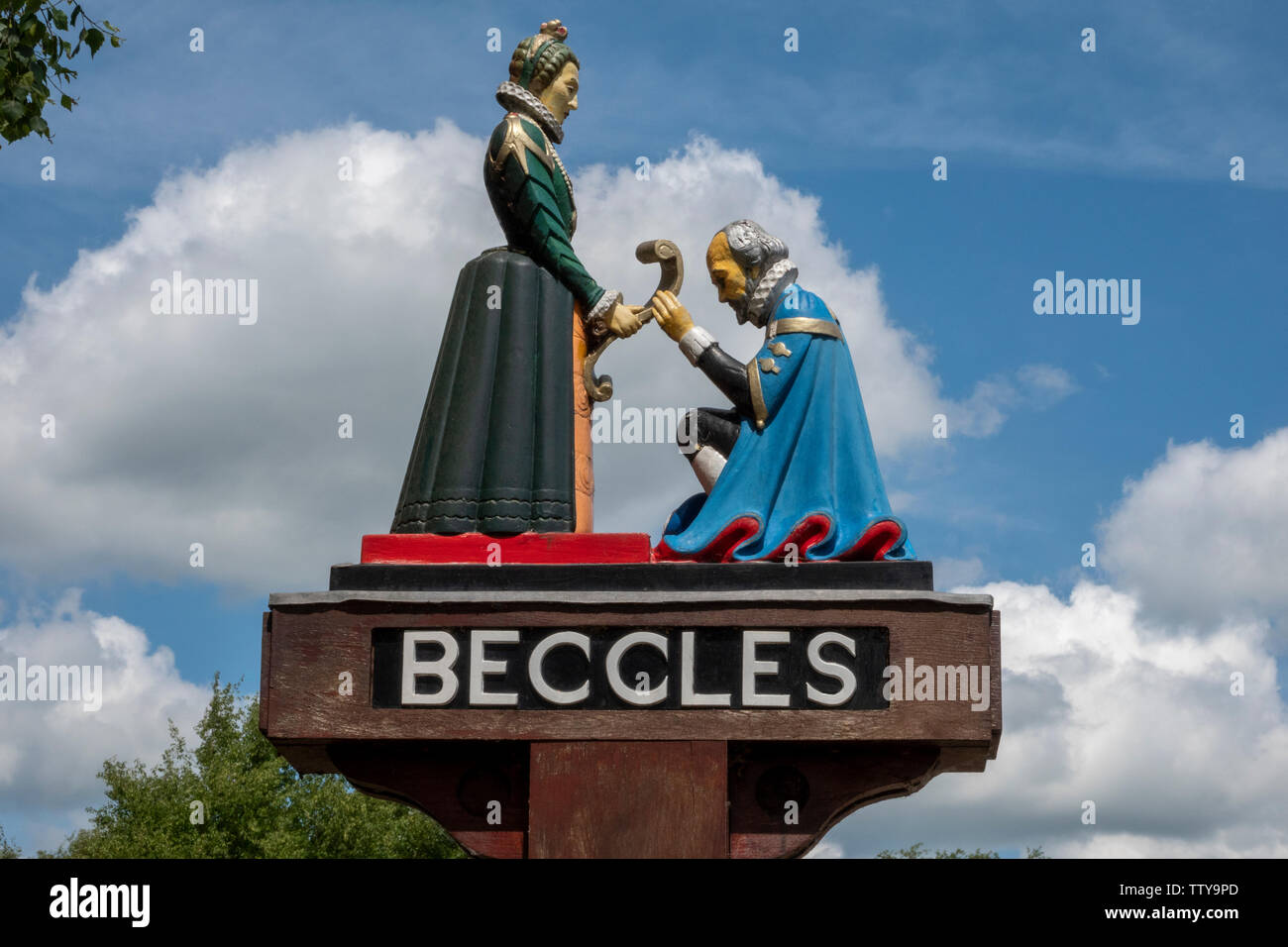 Village sign for Beccles,showing sculpture of Queen Elizabeth I handing ...