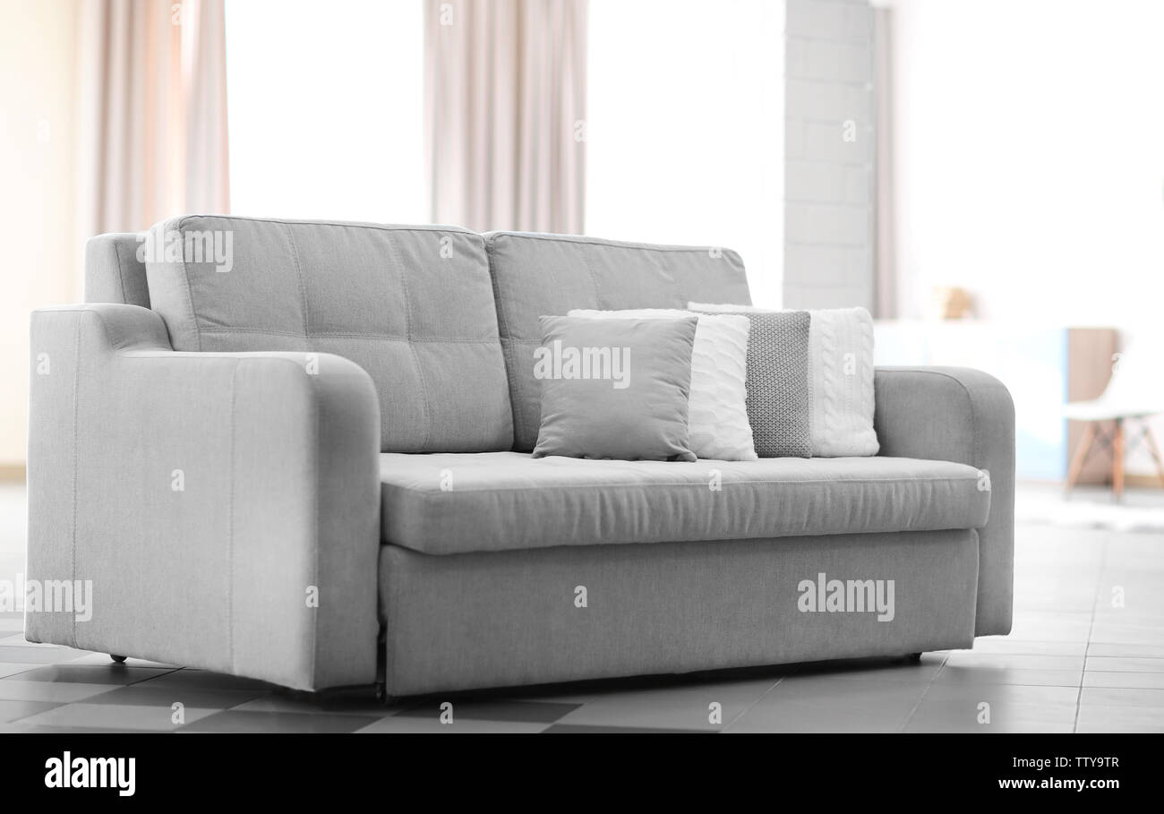 New cozy couch in modern room interior Stock Photo - Alamy