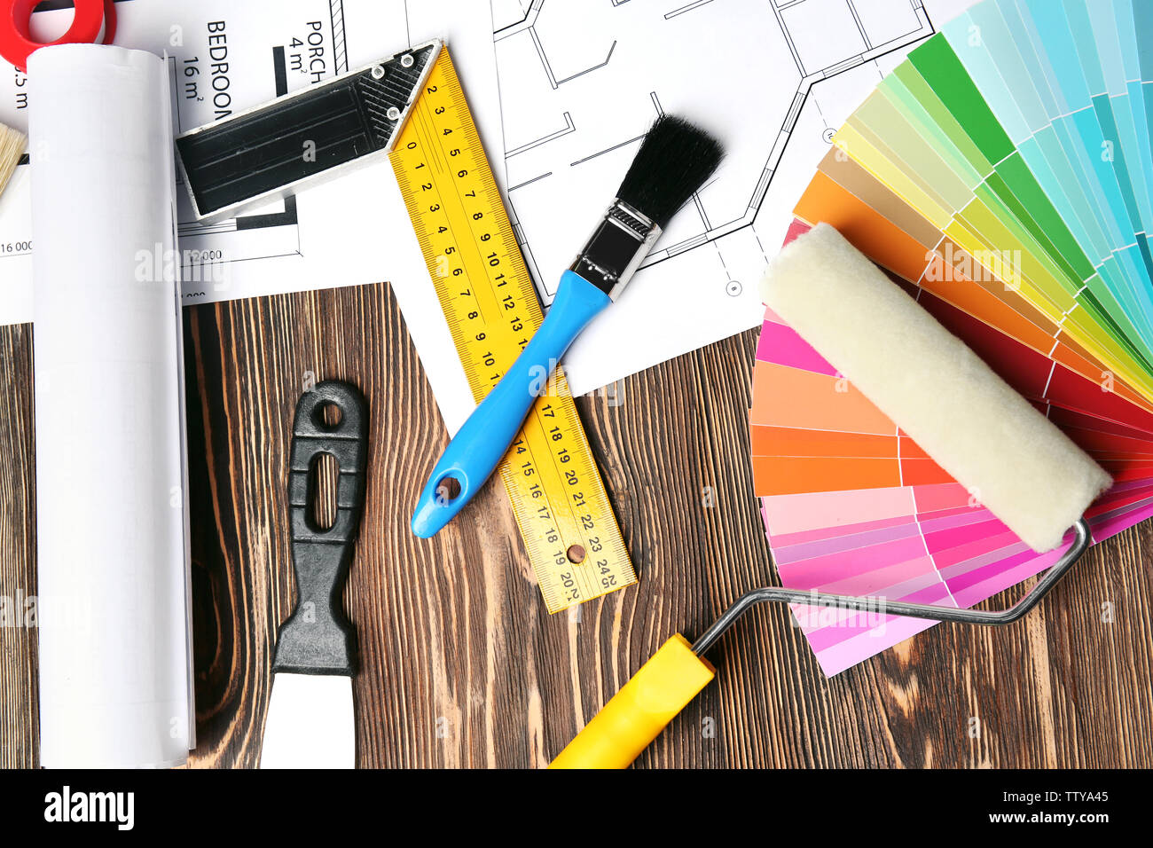 Decorator workplace with house project, color swatches and tools ...