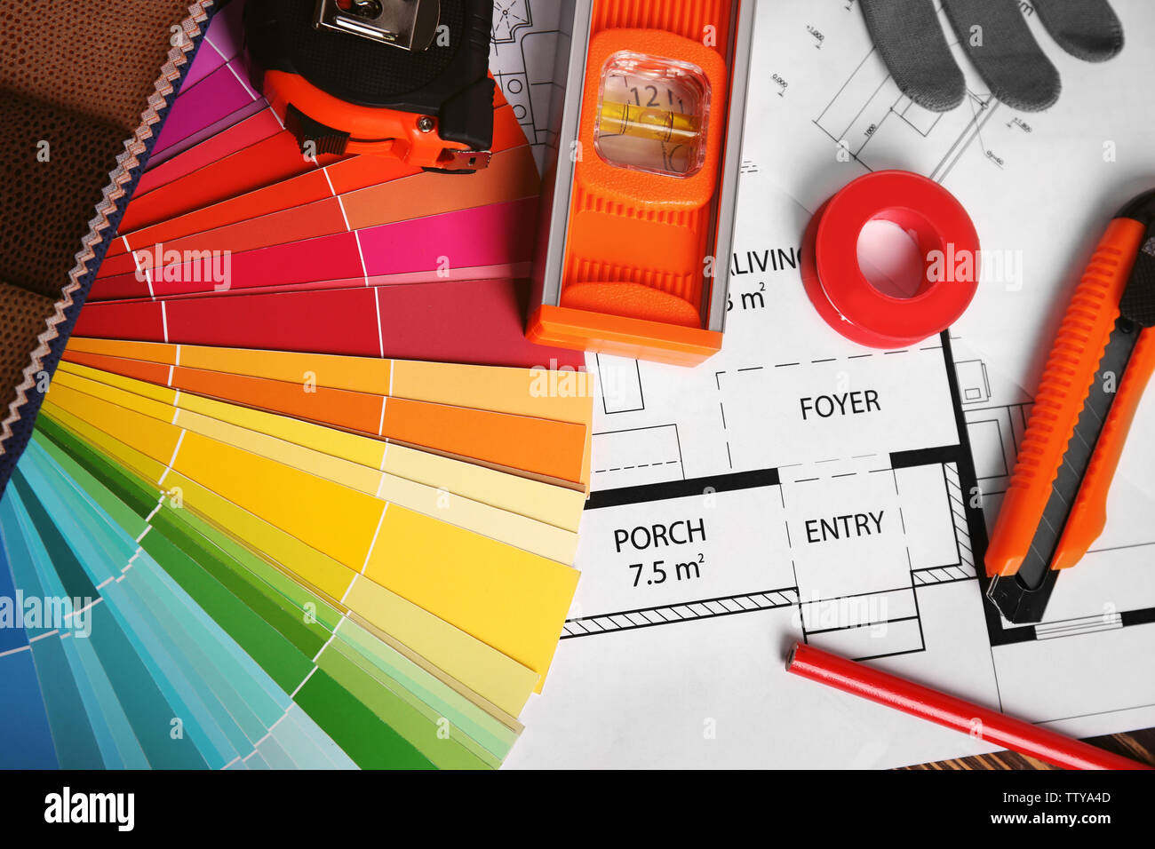 Decorator workplace with house project, color swatches and tools ...